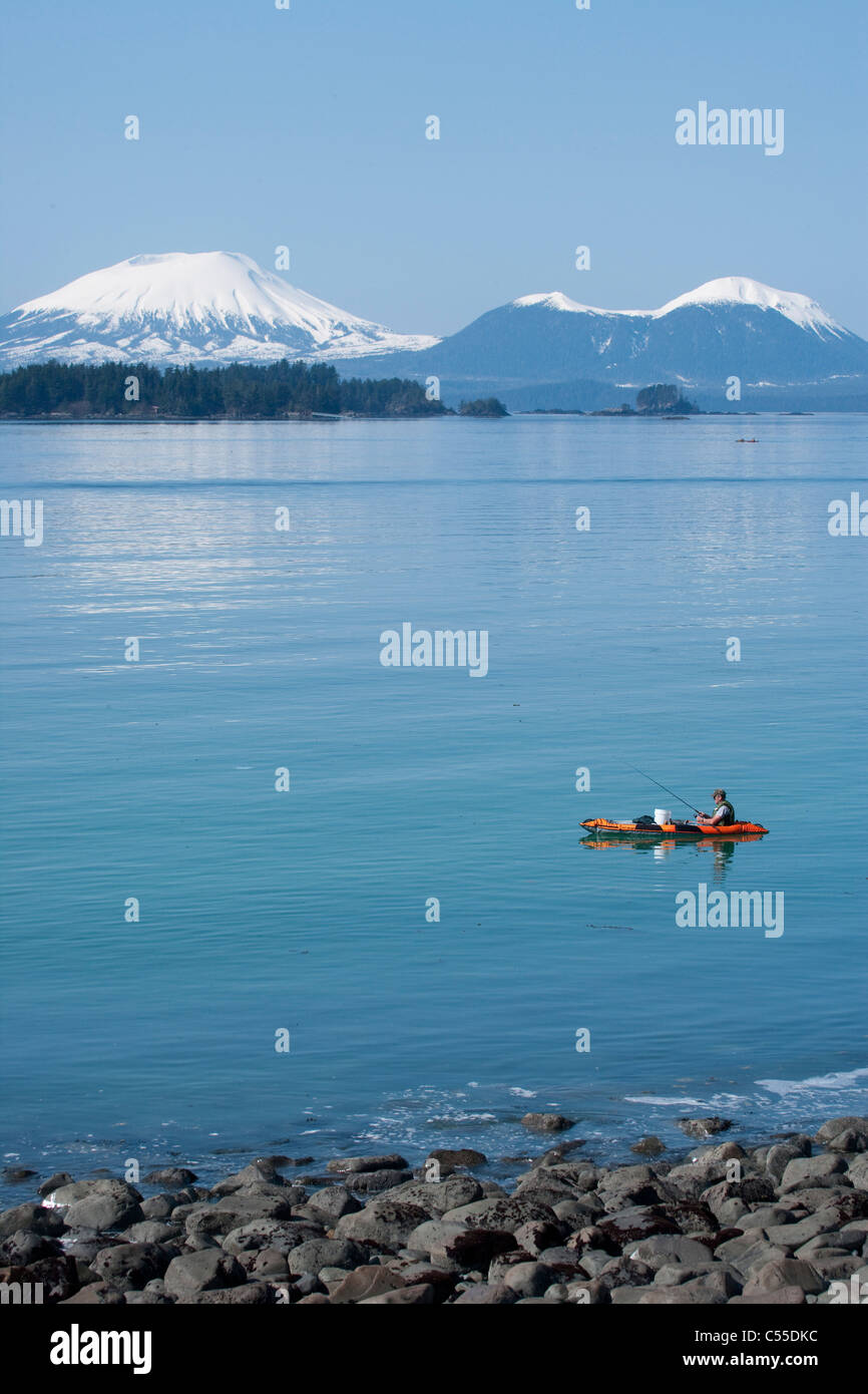 Kayak with mountain ranges in the background, Mt Edgecumbe, Sitka ...