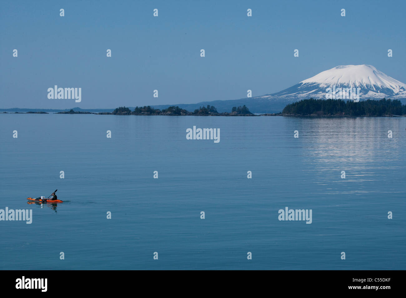 Kayak with a mountain in the background, Mt Edgecumbe, Sitka, Alaska ...