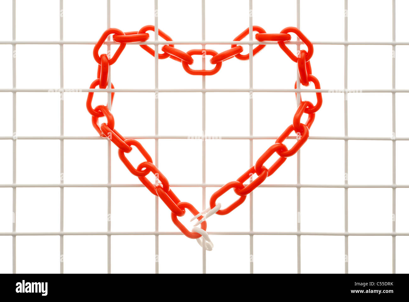 Red chain wrapped around fence Stock Photo - Alamy