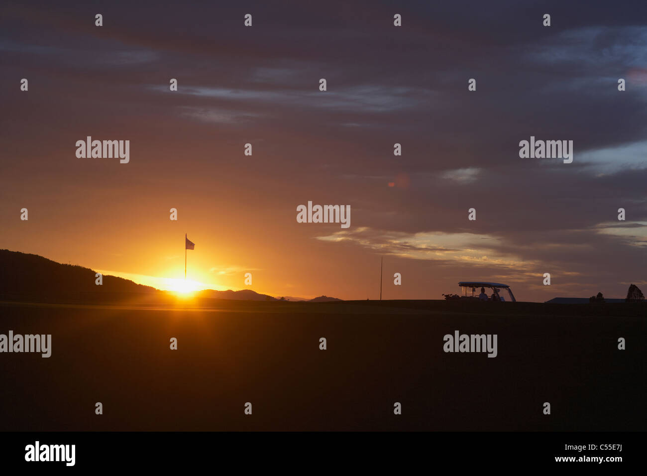Golf course in sunset Stock Photo - Alamy