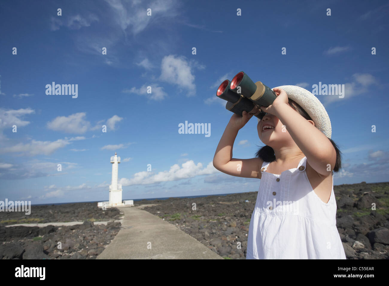 A girl looking at a telescope Stock Photo - Alamy