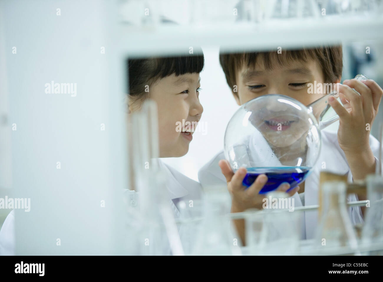 Two children doing experiment Stock Photo - Alamy