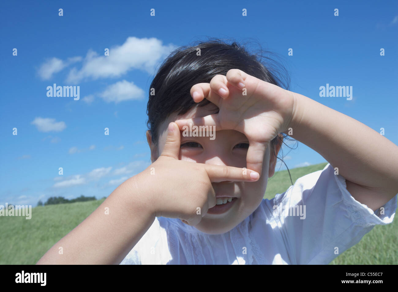 A girl making a square on her face Stock Photo - Alamy