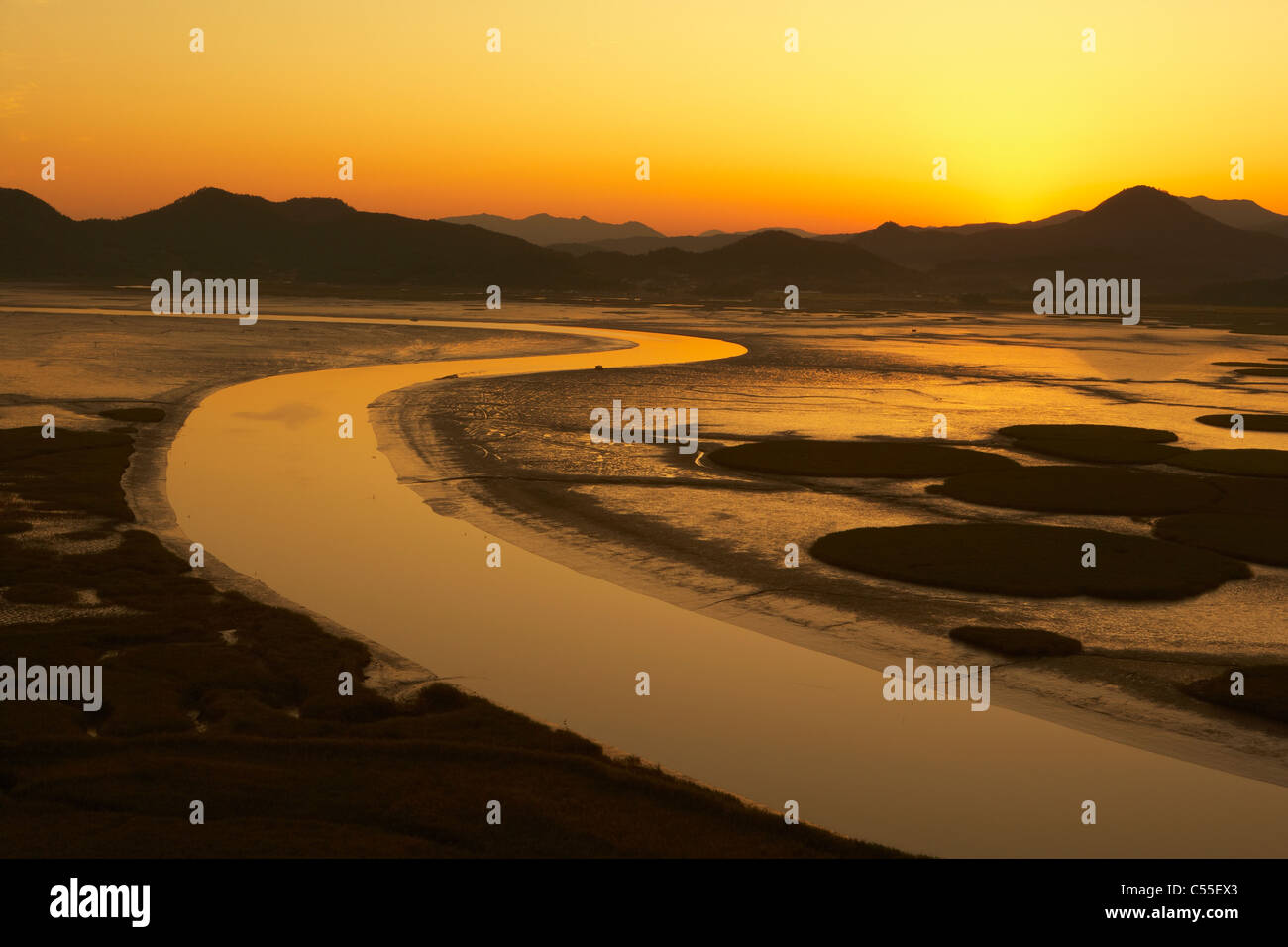 Curved river in twilight Stock Photo - Alamy