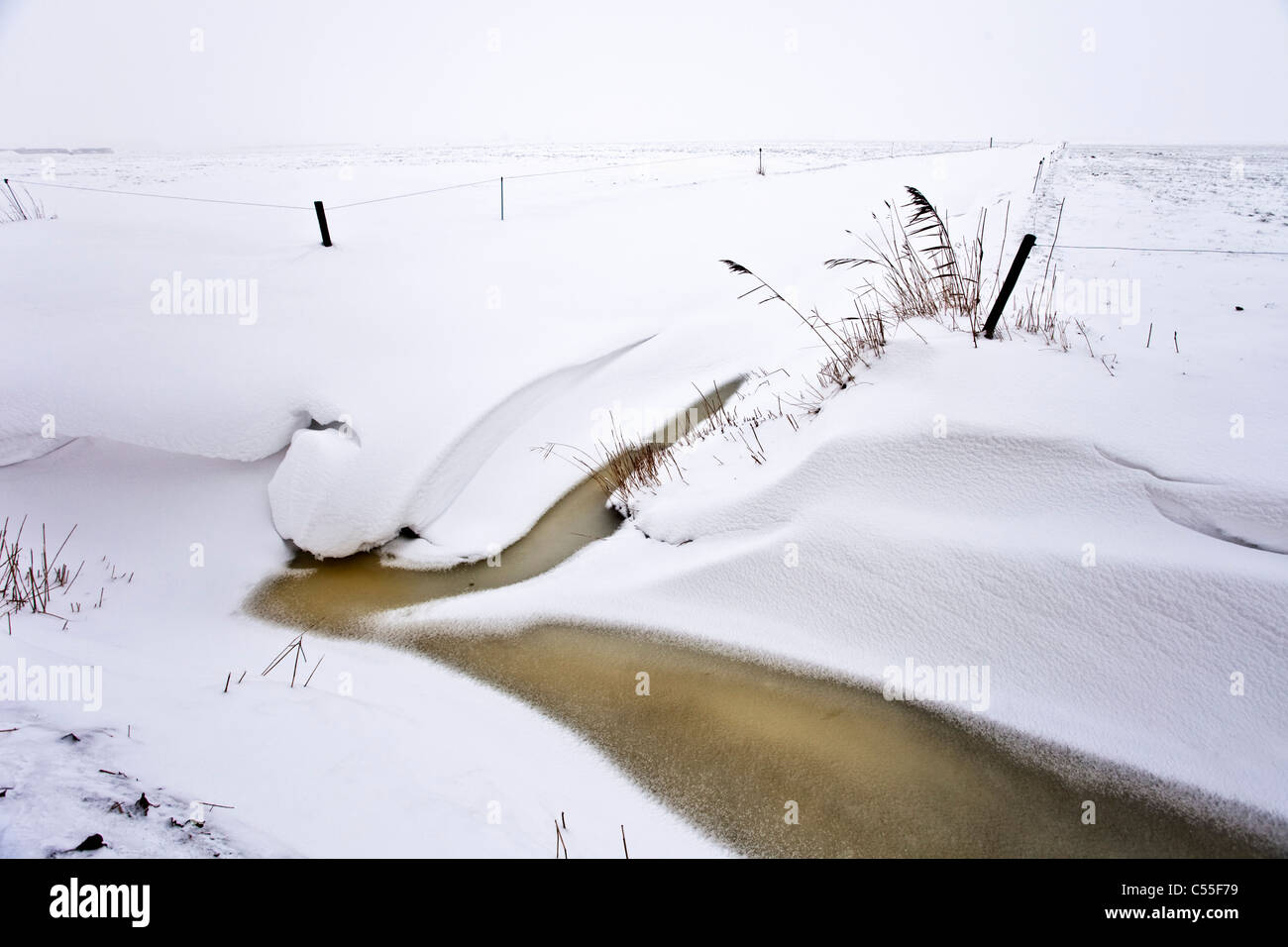 The Netherlands, Uithuizen, Snow in canal Stock Photo - Alamy