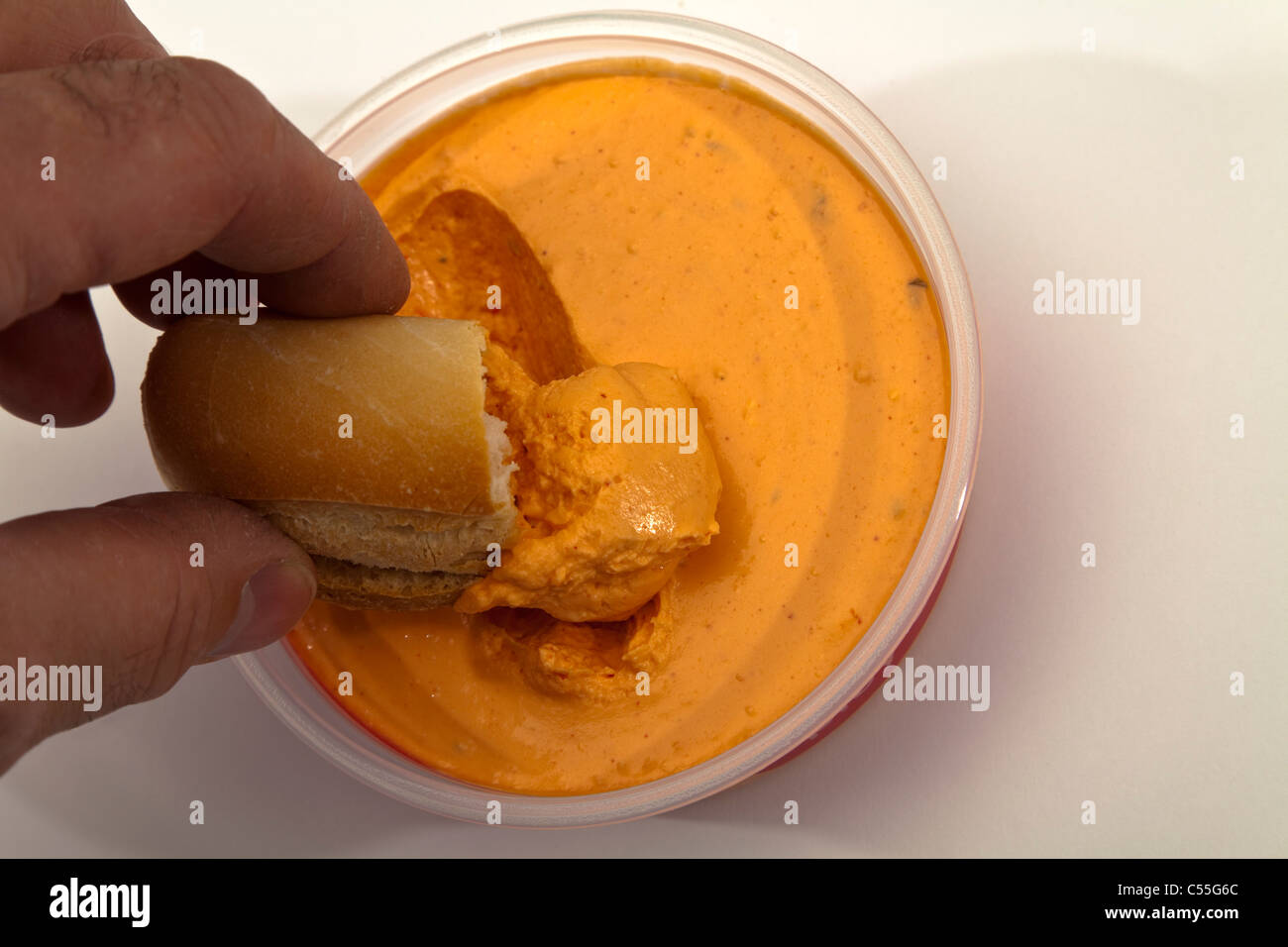Close up persons hand dipping hi-res stock photography and images - Alamy