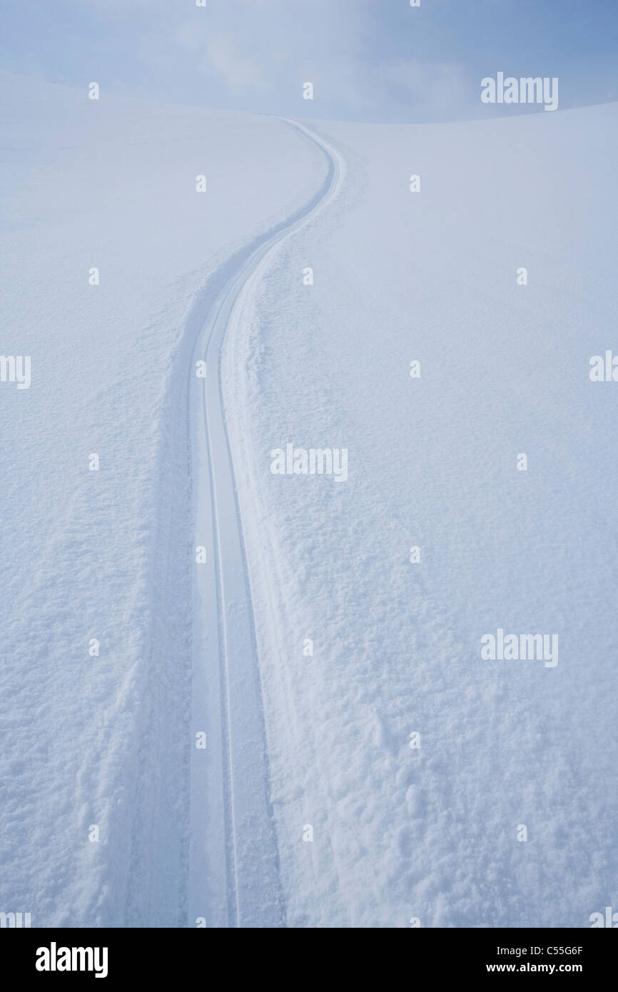 wheel track on snow field Stock Photo - Alamy