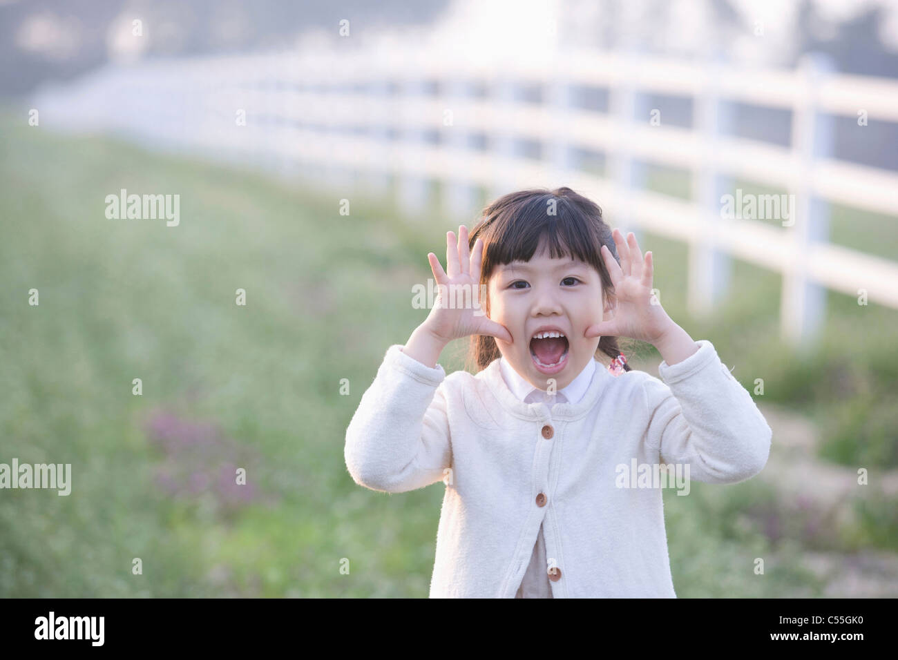 girl shouting with a smile Stock Photo - Alamy