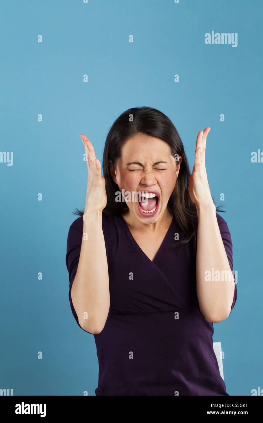 Young woman shouting Stock Photo - Alamy