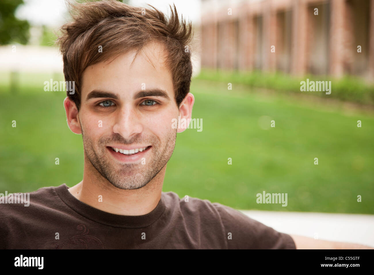 Portrait of a young man smiling Stock Photo - Alamy