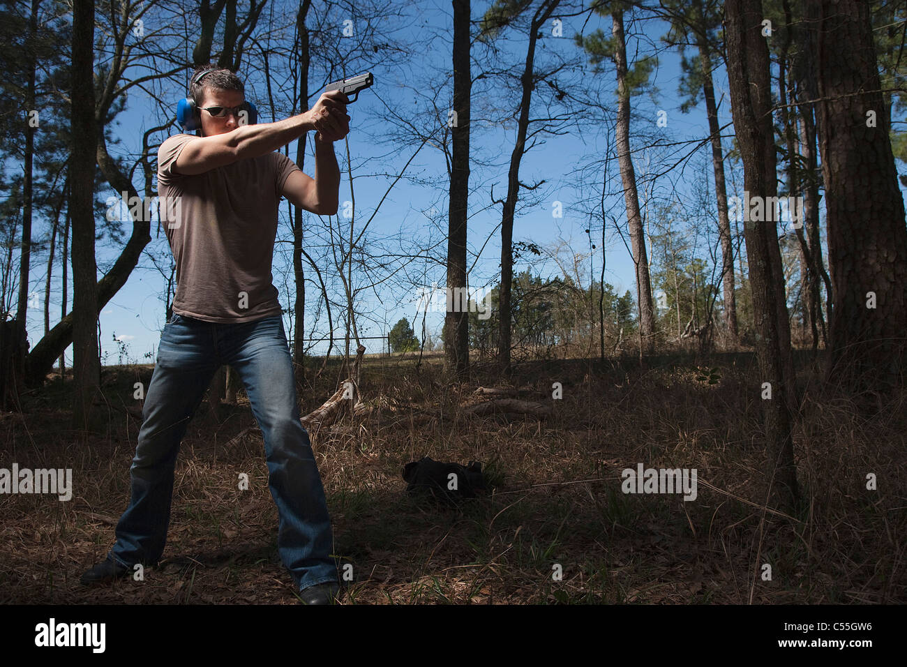 Man practicing target shooting Stock Photo - Alamy