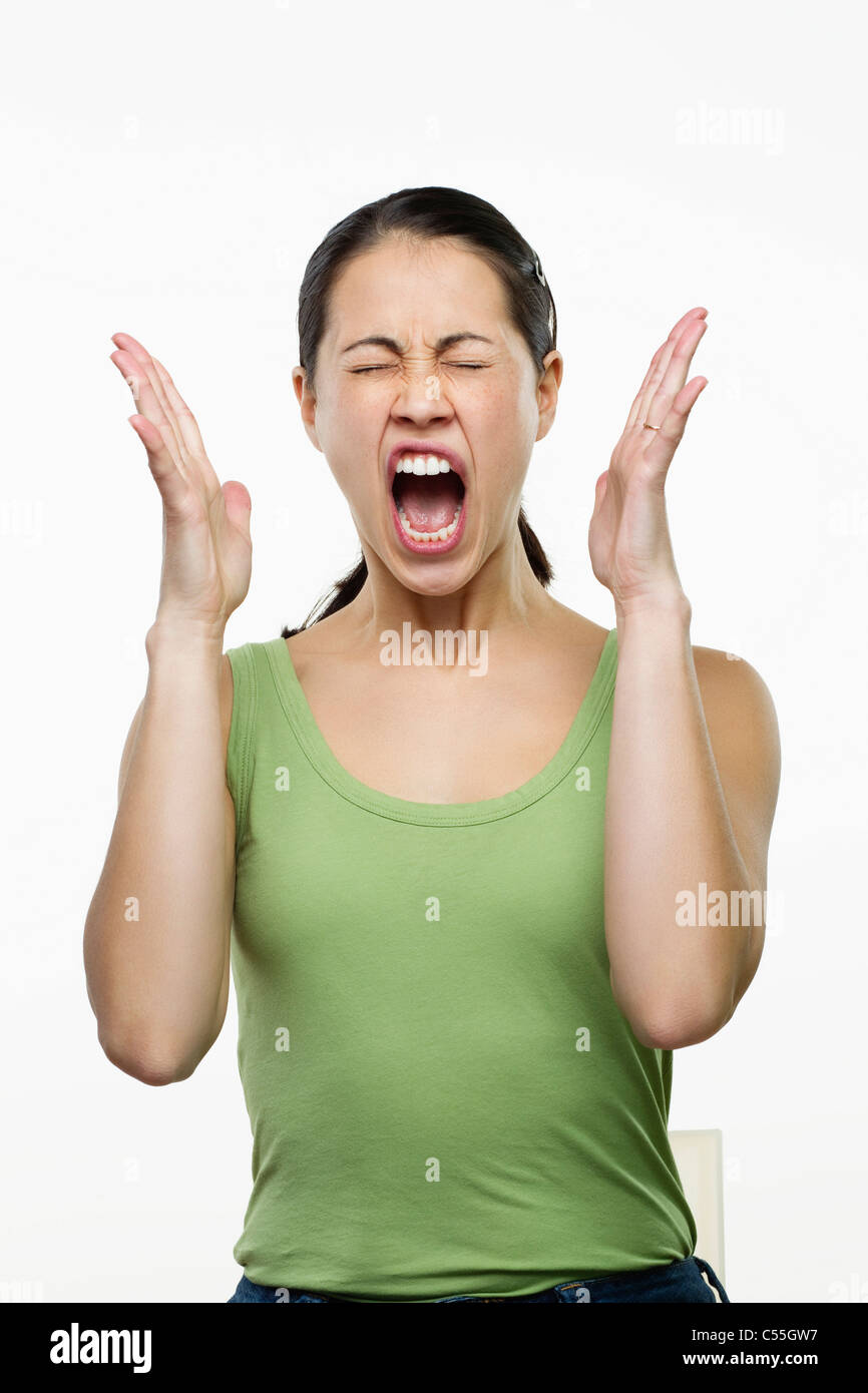 Young woman screaming Stock Photo - Alamy