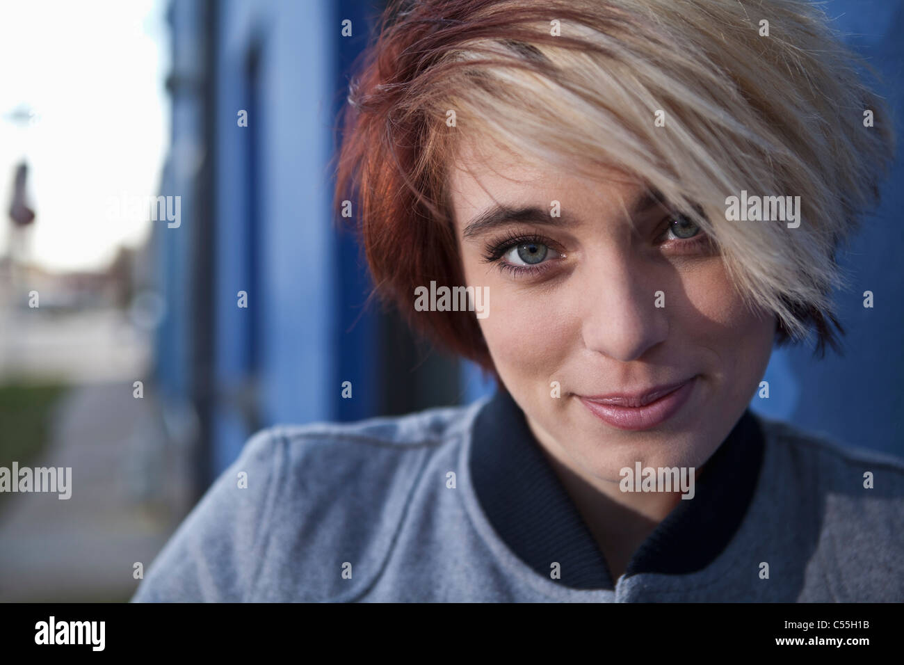 Portrait of punk girl smiling, outdoors Stock Photo - Alamy