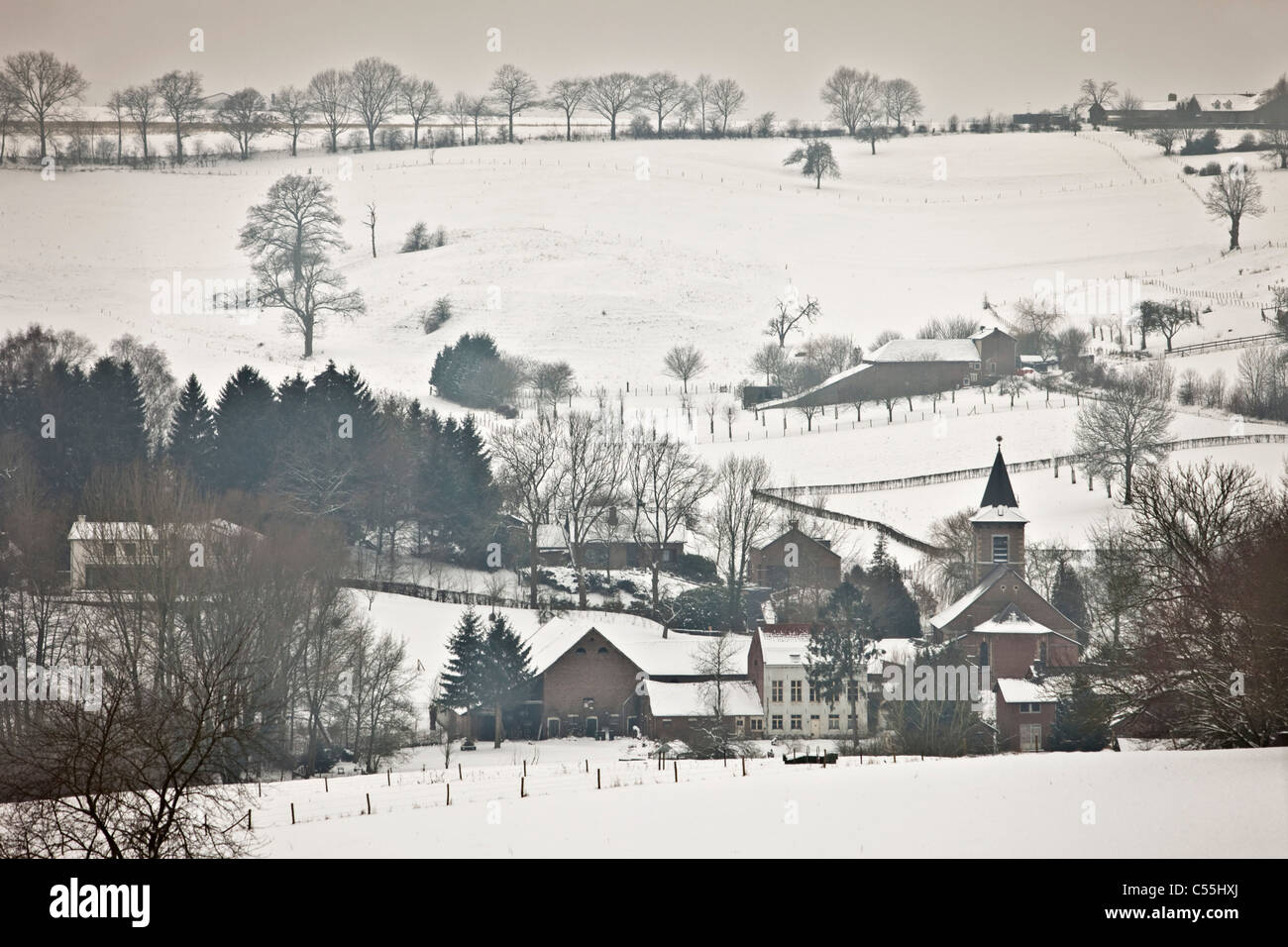 The Netherlands, Slenaken, View on village in winter, snow Stock Photo ...