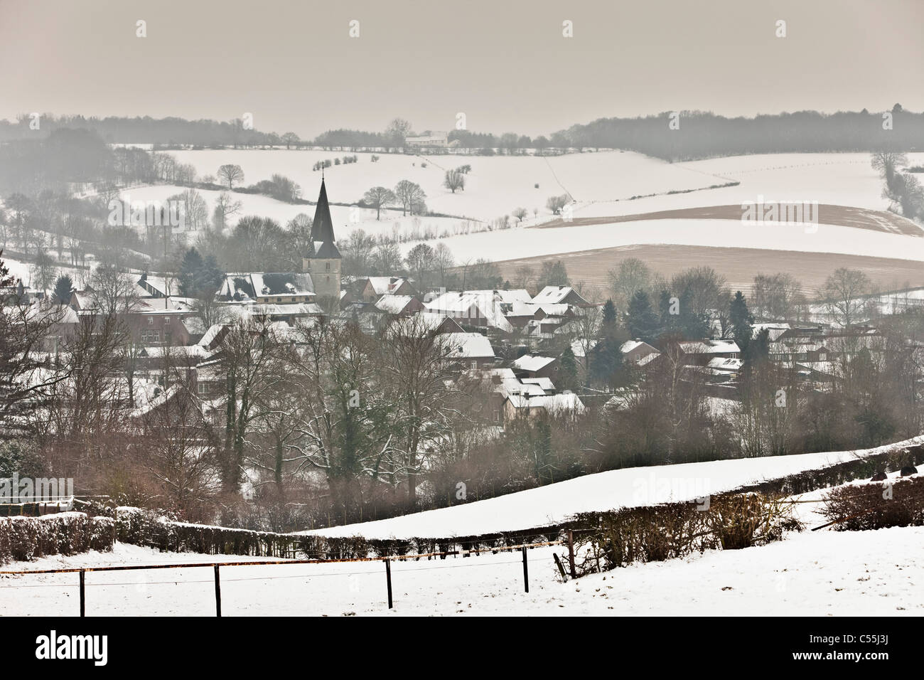 The Netherlands, Noorbeek, View on village in winter, snow Stock Photo ...