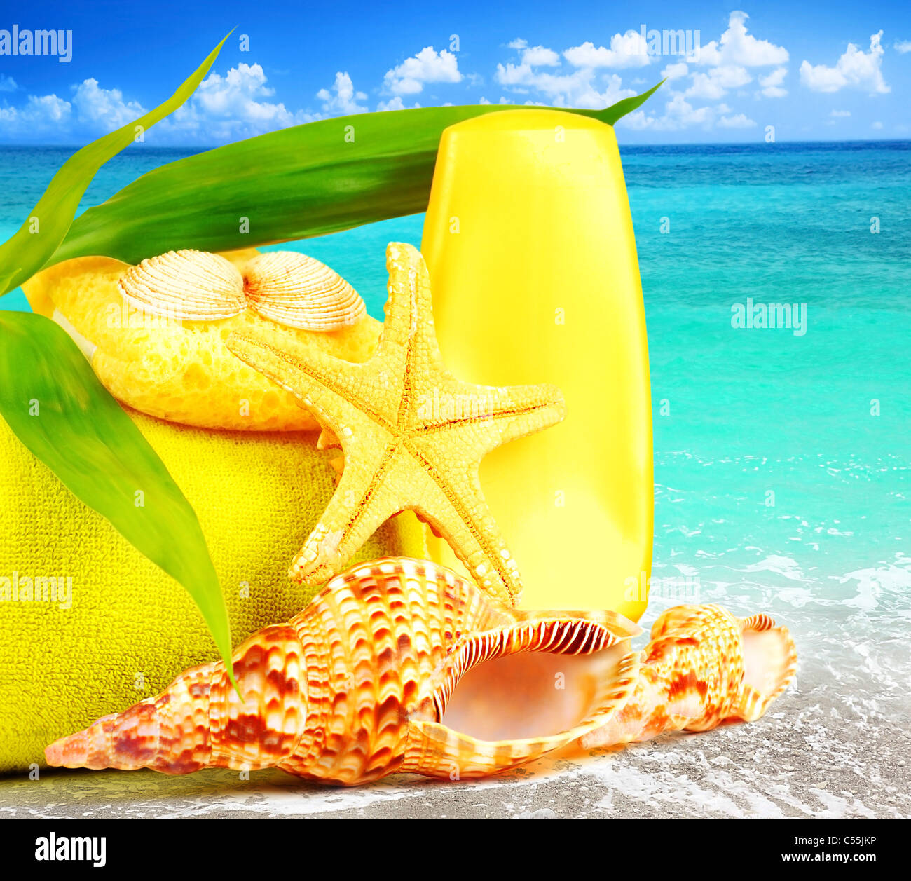 Beach items over blue sea conceptual image of summertime vacation ...