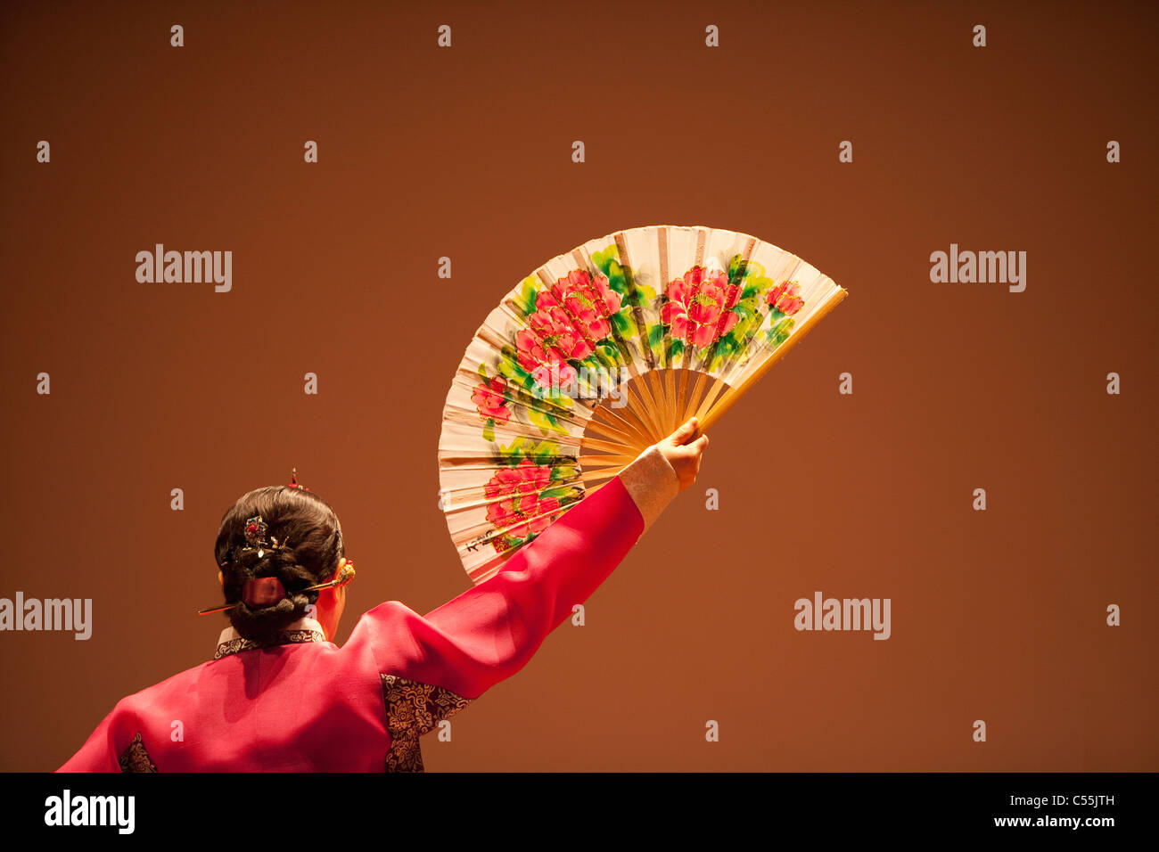 wonan in hanbok raised her hand with a fan Stock Photo - Alamy