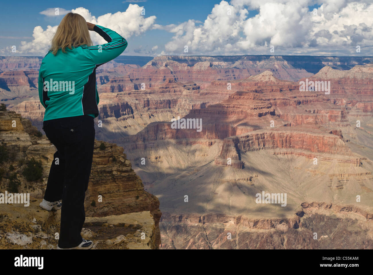 Tourist woman looking out over Powell Point, Grand Canyon National Park ...
