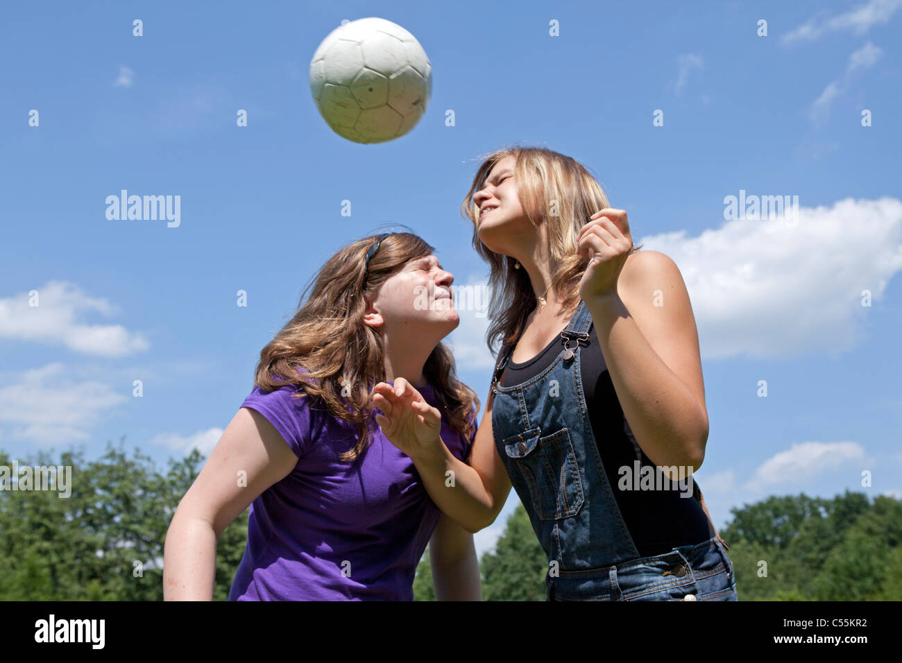 Girl heading football hi-res stock photography and images - Alamy