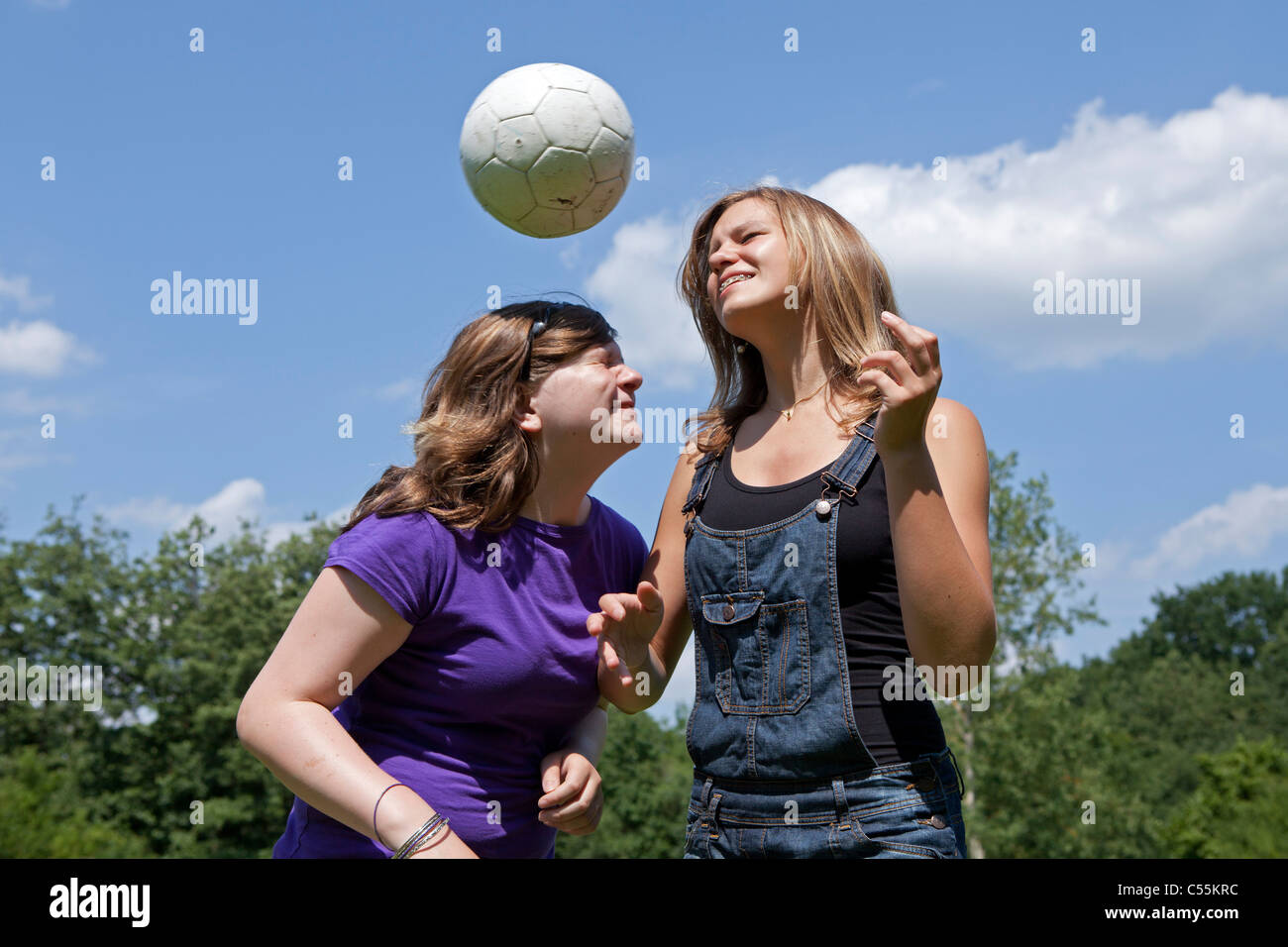 Kids playing football head hi-res stock photography and images - Alamy