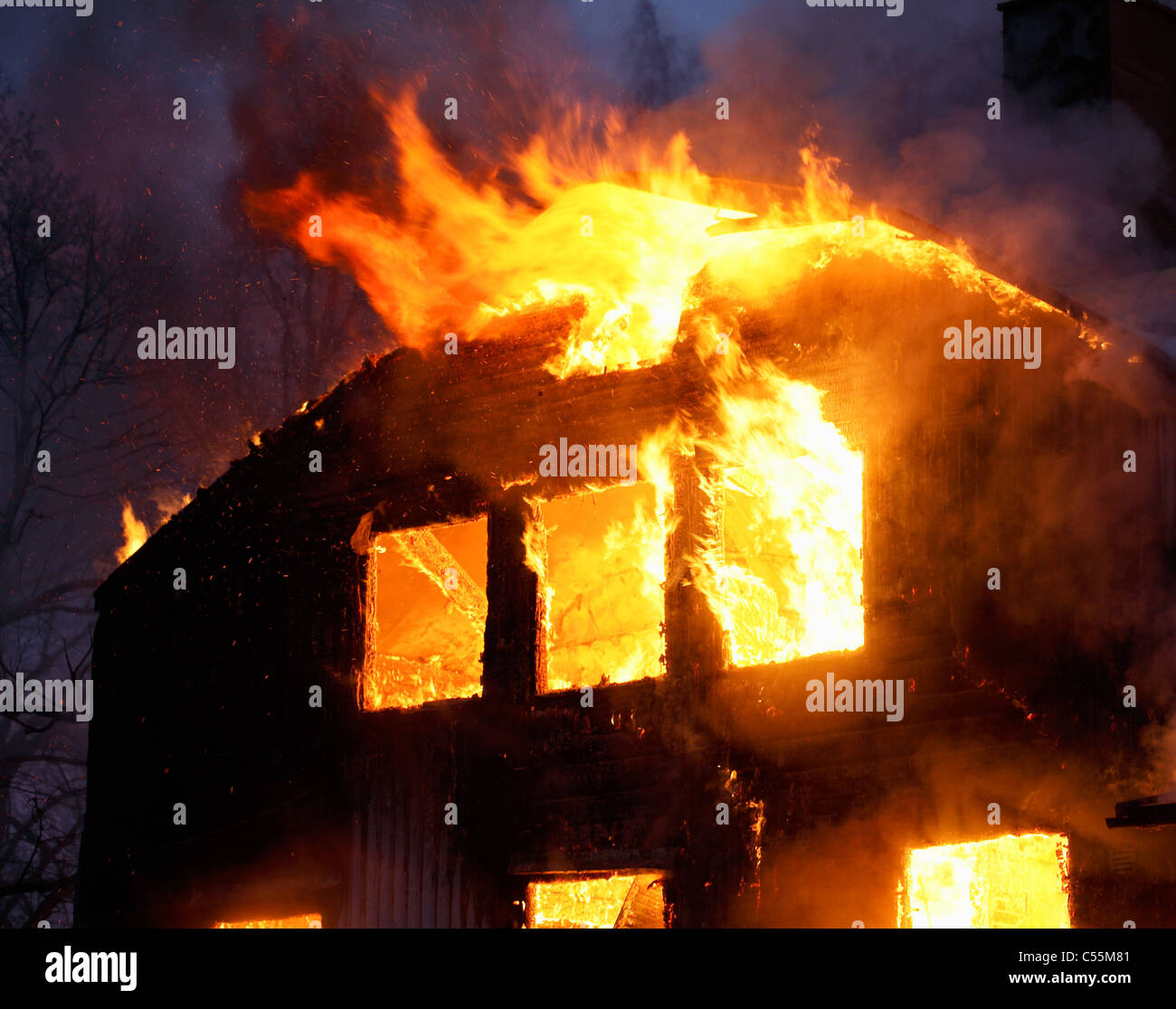Wooden house buring Stock Photo - Alamy