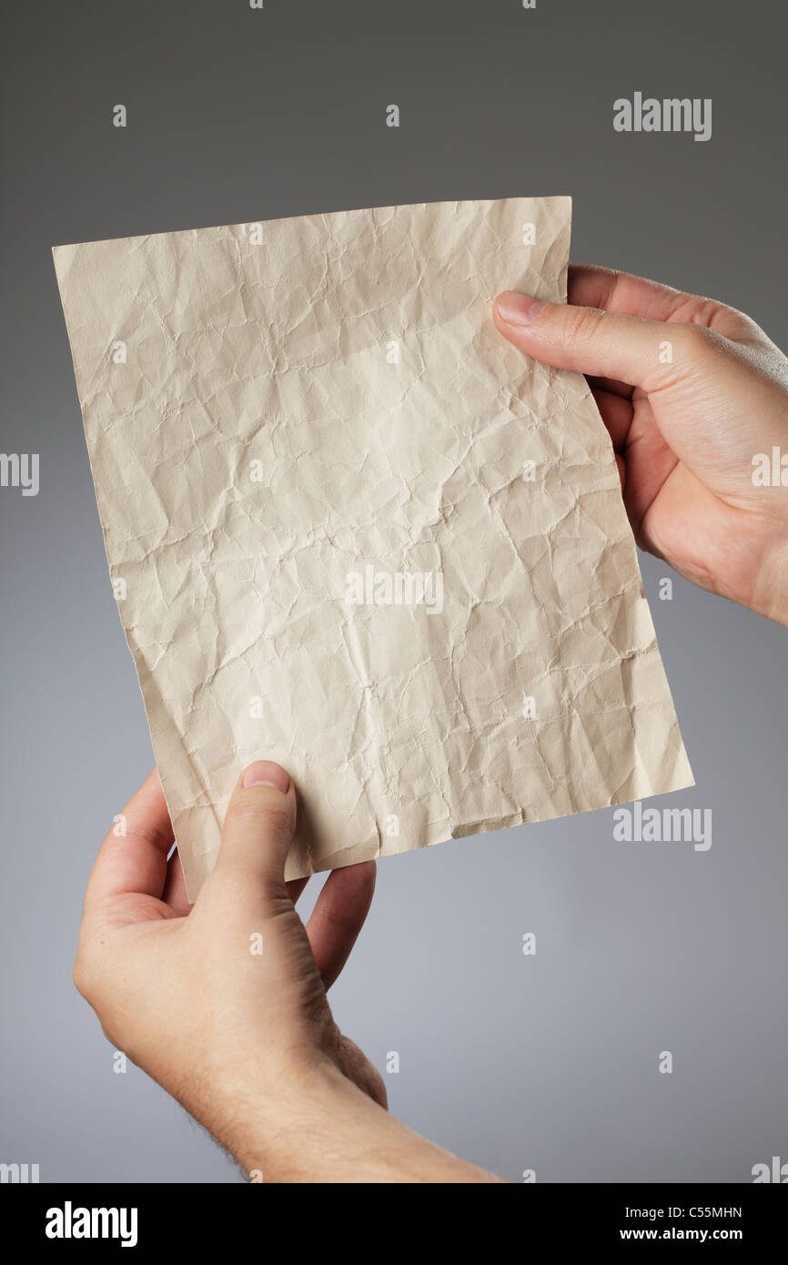 Male Hands Crumpling Paper