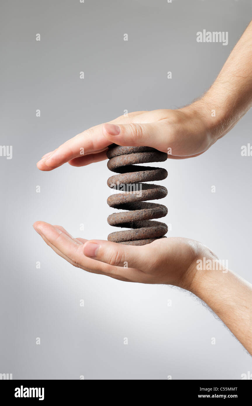 Hand spring compressing hi-res stock photography and images - Alamy
