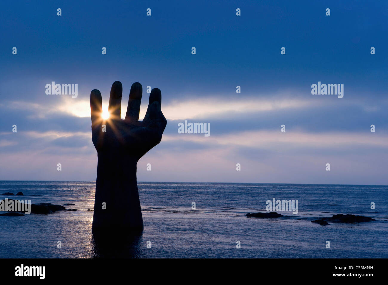 Statue in the sea under the sunset glow hi-res stock photography and ...