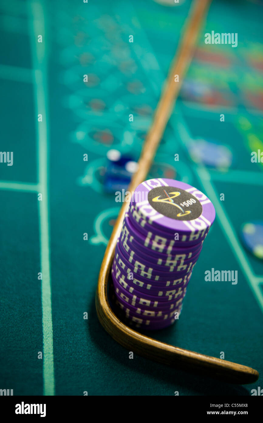 Stack of chips an poker table Stock Photo - Alamy