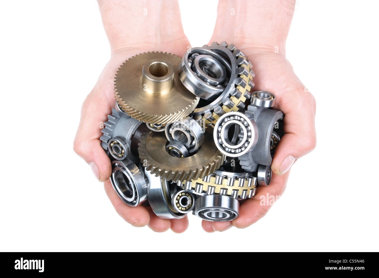 Hands hold a heap of bearings and a gears wheel on a white background ...