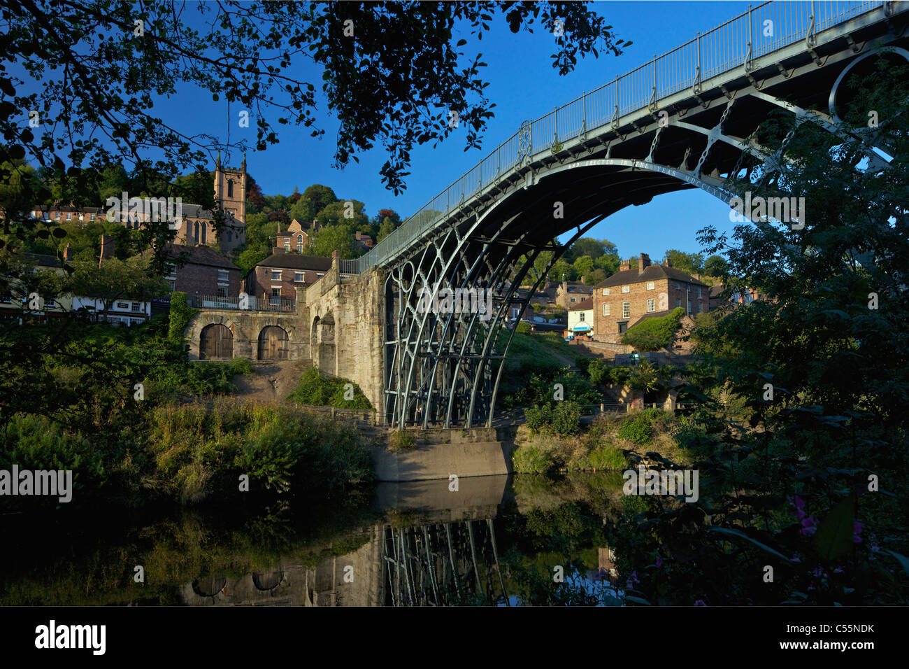 Reflection of an iron bridge and trees in a river, River Severn ...
