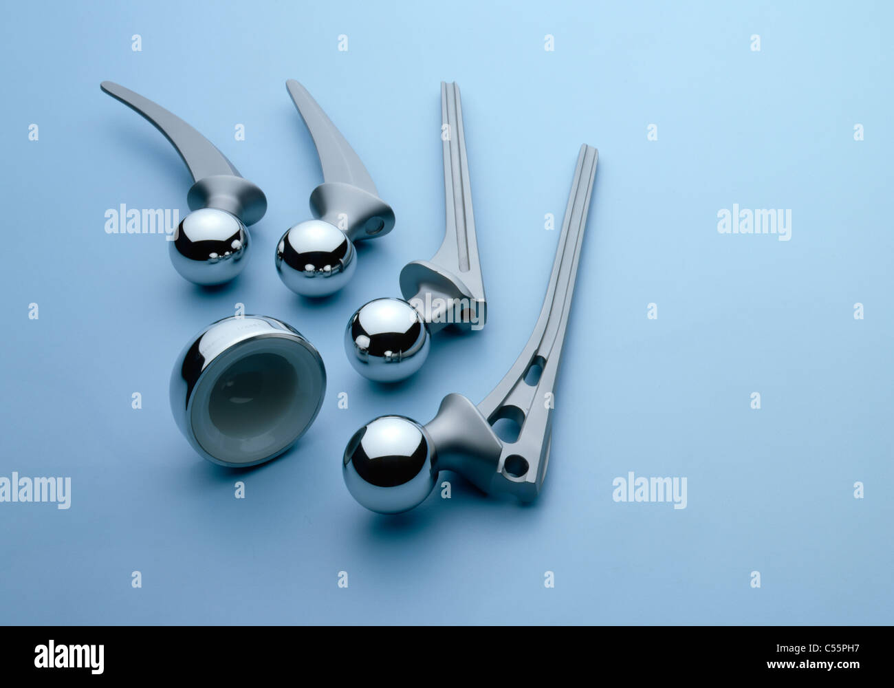 Artificial hip implants on blue background, studio shot Stock Photo - Alamy
