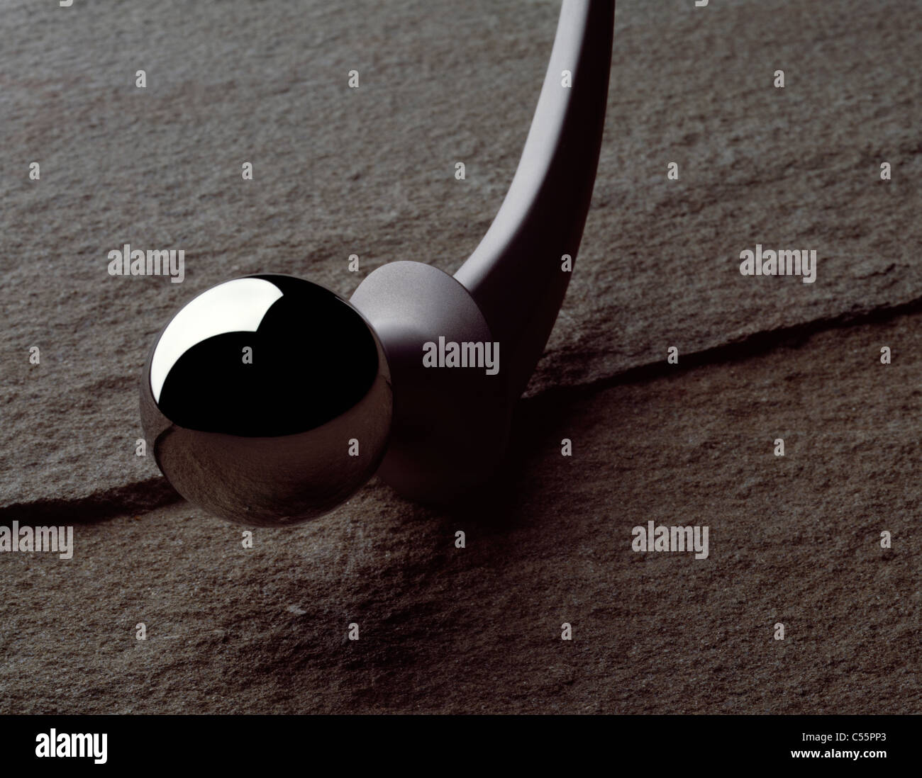 Close-up of titanium hip against rock background, studio shot Stock ...