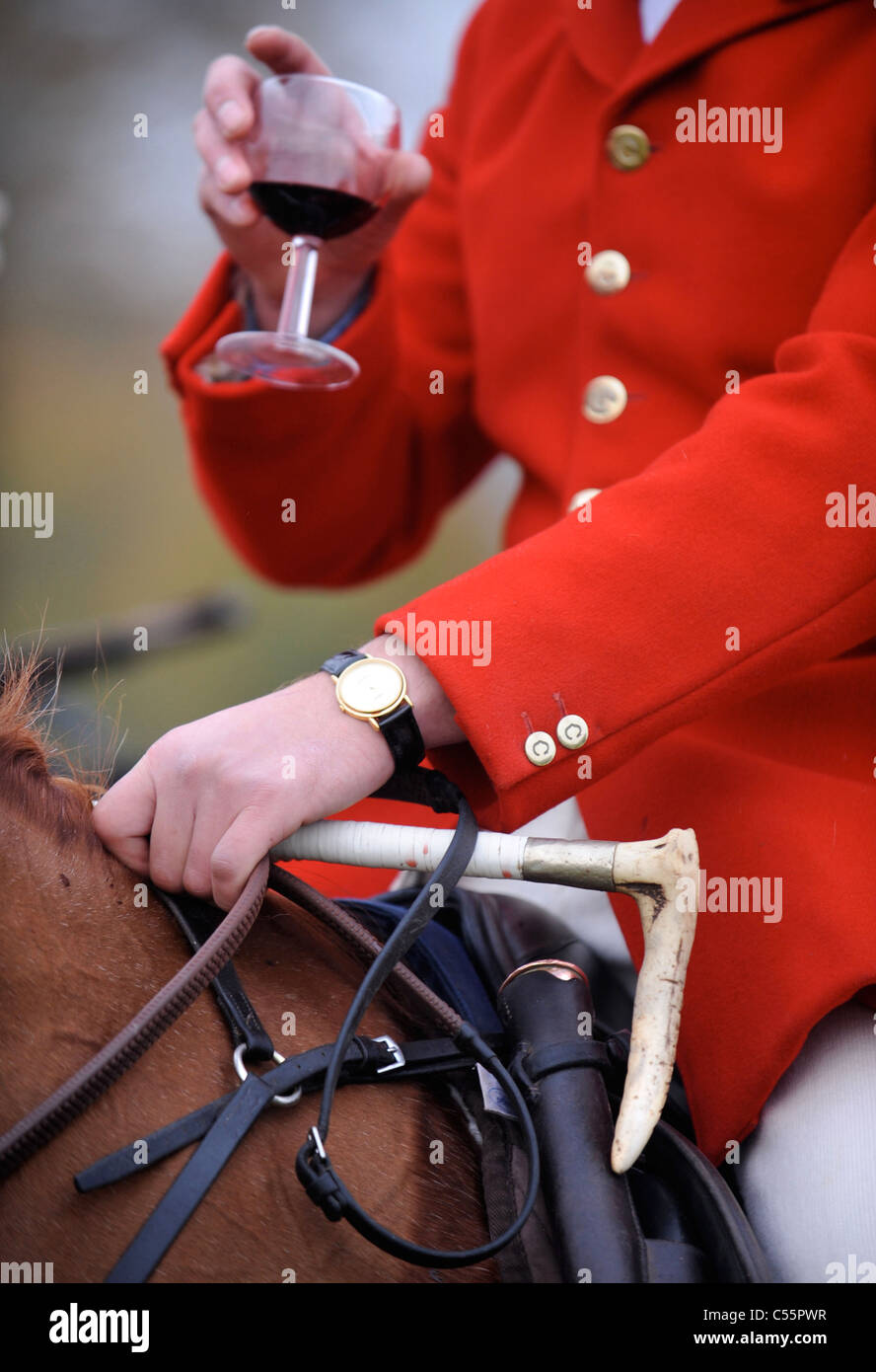 A huntsman enjoying the traditional stirrup cup at a Cotswold Hunt ...