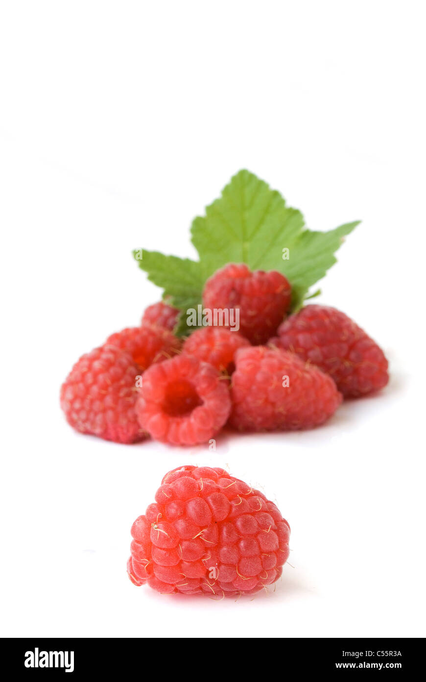 ripe red raspberries isolated on white background Stock Photo - Alamy
