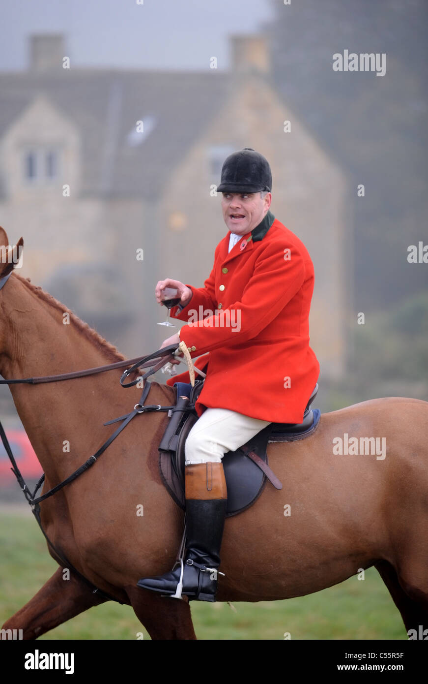 A huntsman enjoying a stirrup cup at the 150th anniversary Cotswold ...