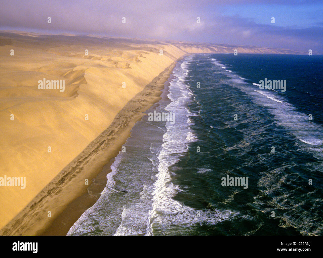 The Long Mall the high dunes of The Namib desert rise steeply above the ...