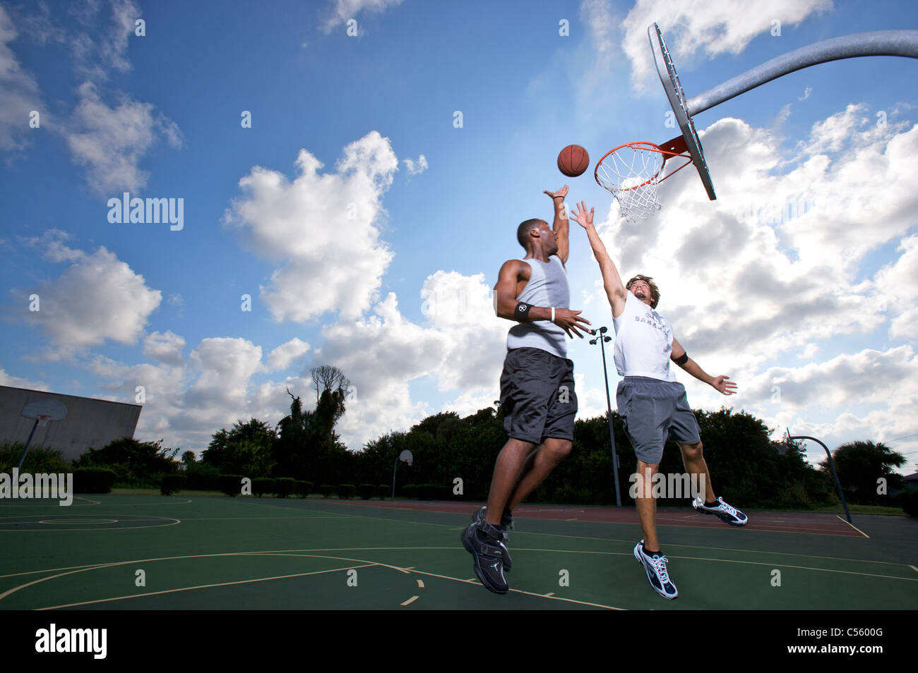 Two males with basketball hi-res stock photography and images - Alamy
