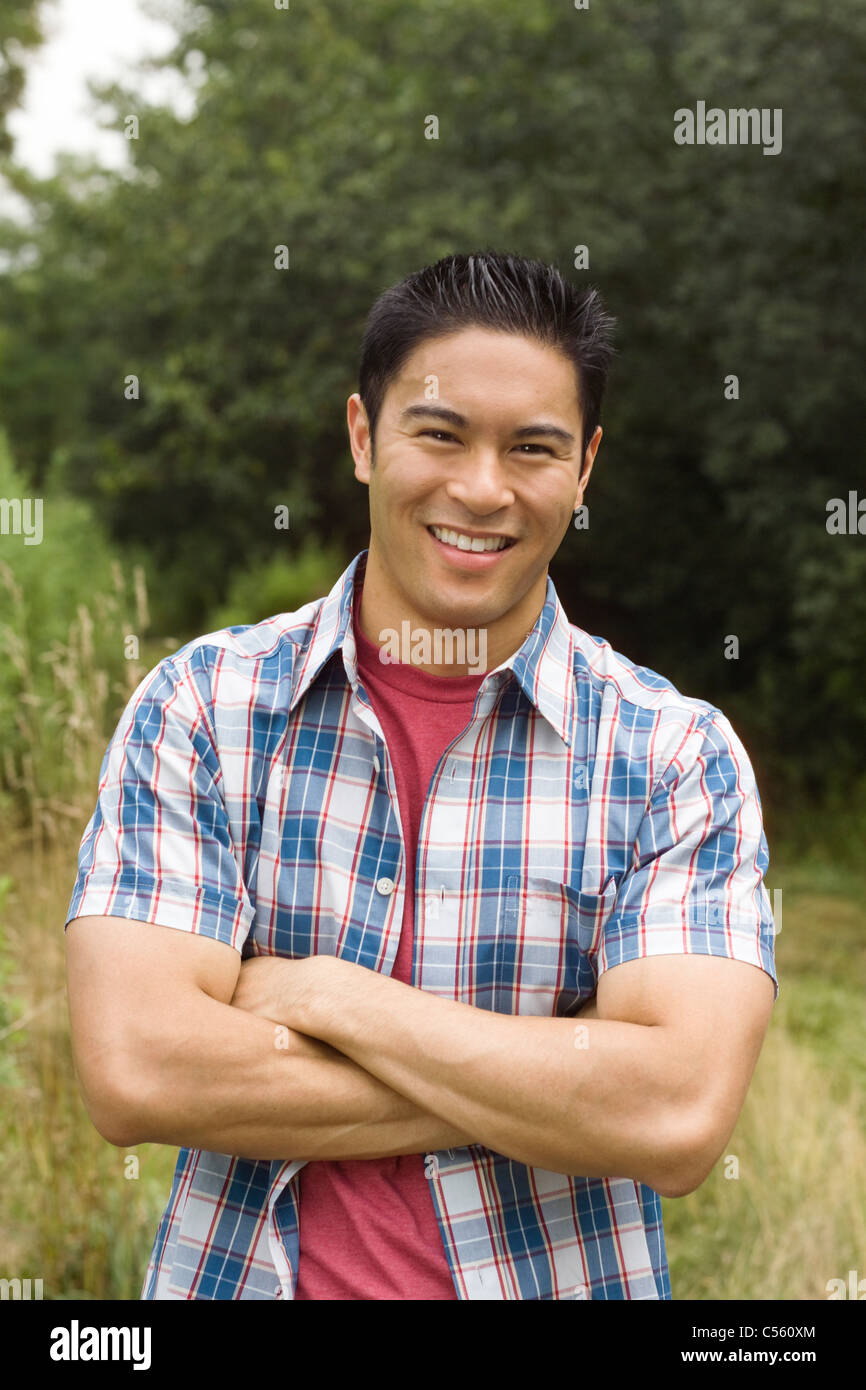 Mid adult man standing in a field Stock Photo - Alamy