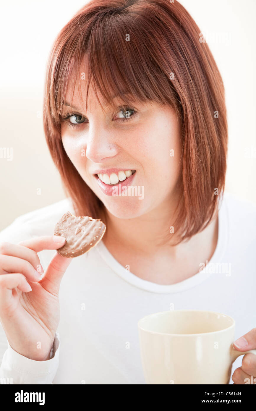 Biting into chocolate digestive biscuit hi-res stock photography and ...
