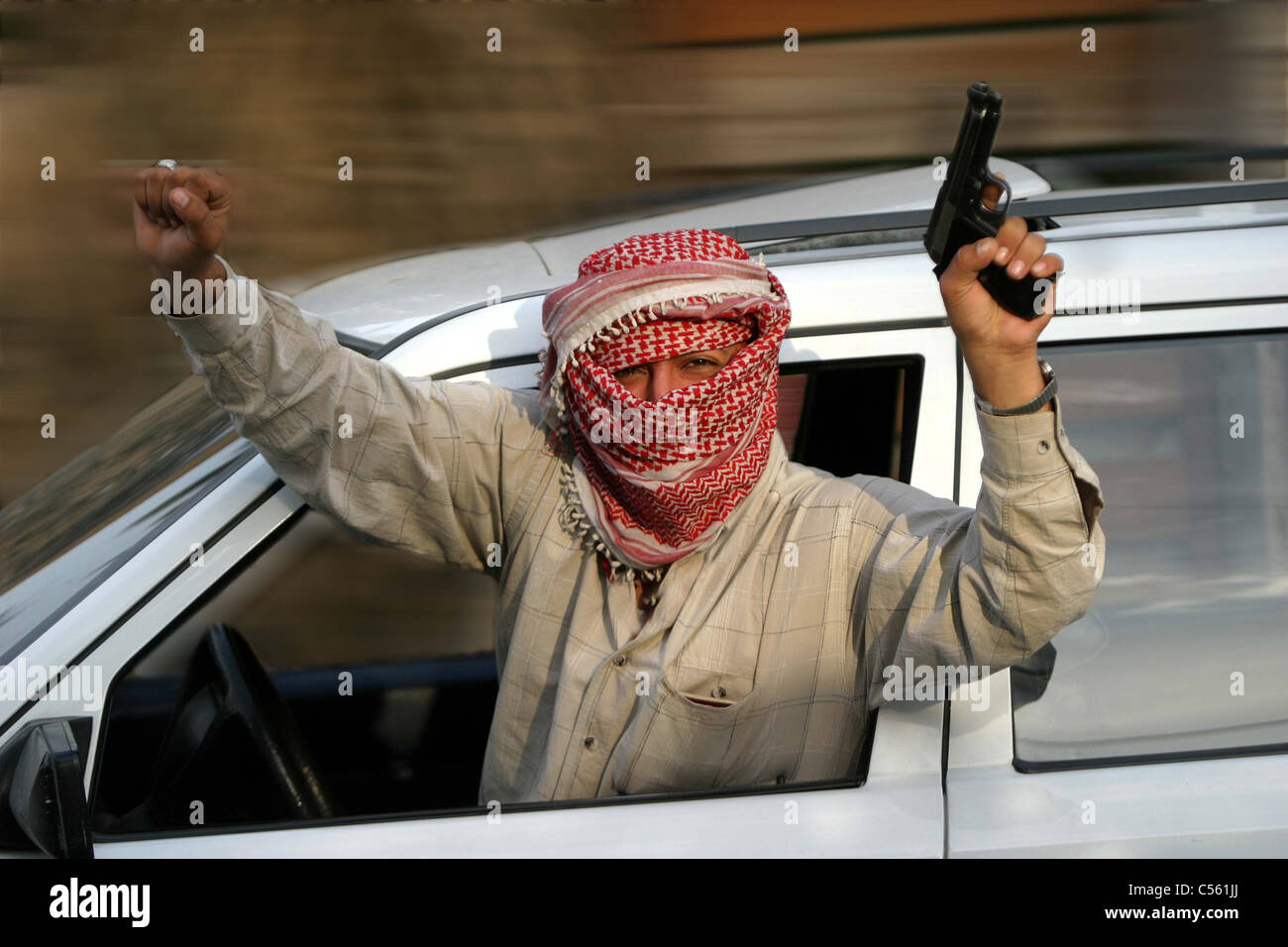 Arab man holding gun hi-res stock photography and images - Alamy