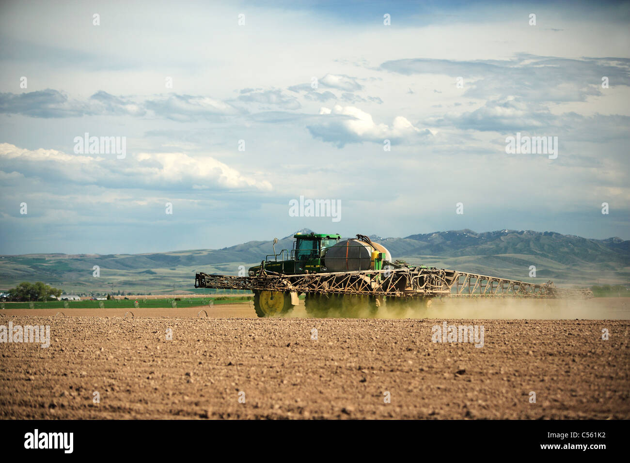 A tractor working in a farm field Stock Photo - Alamy
