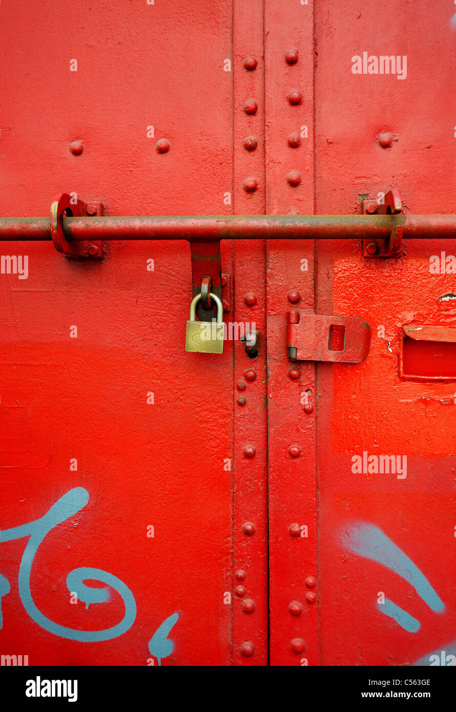 Close up of red metal door Stock Photo - Alamy