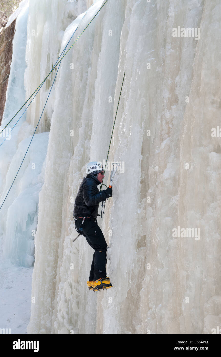Male ice climber on Champney Falls in the White Mountain National ...