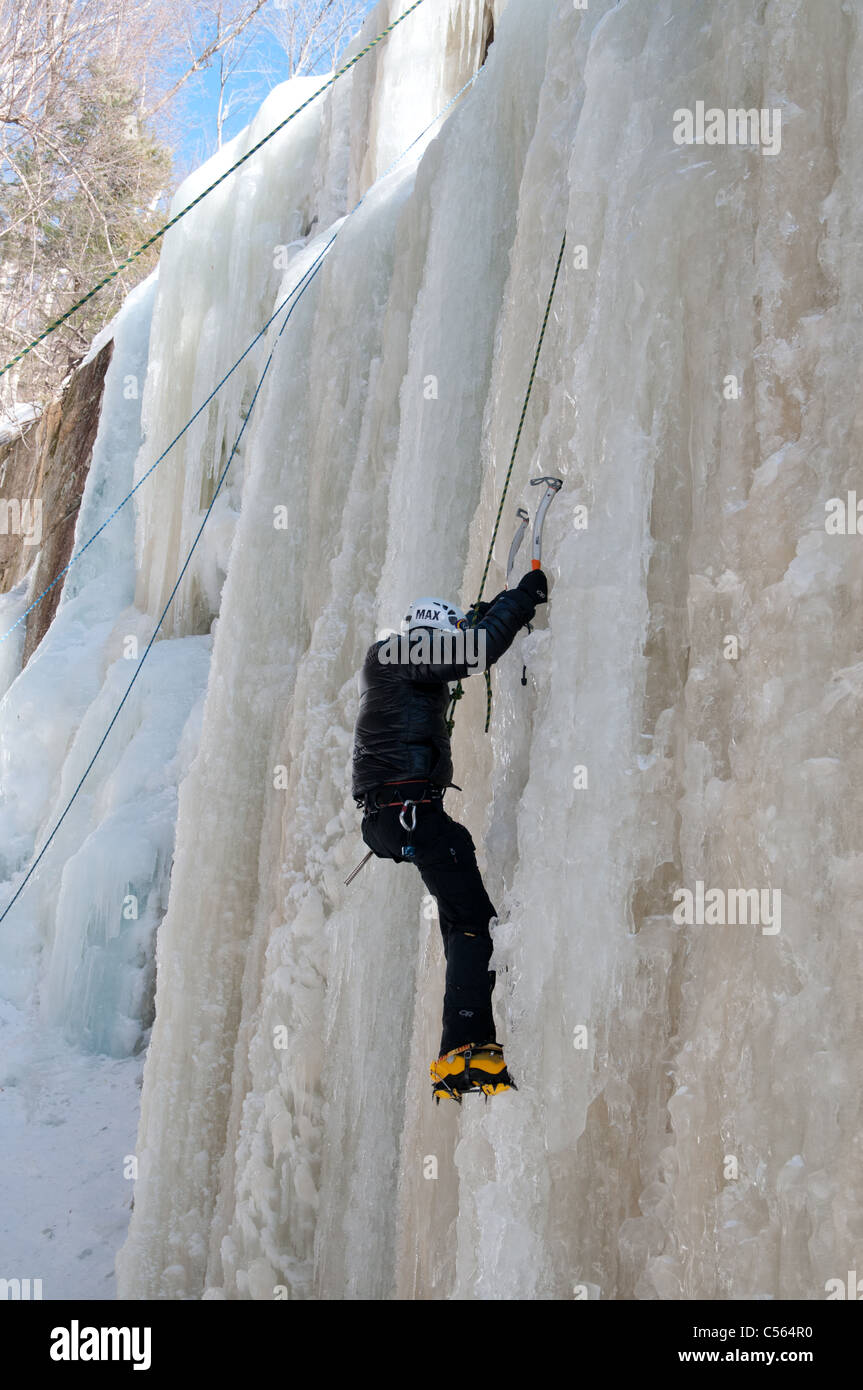 Male ice climber on Champney Falls in the White Mountain National ...