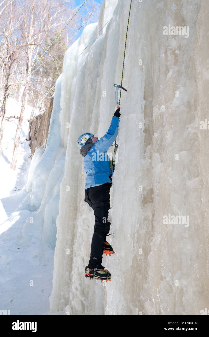 Female Ice climber on Champney Falls in the White Mountain National ...