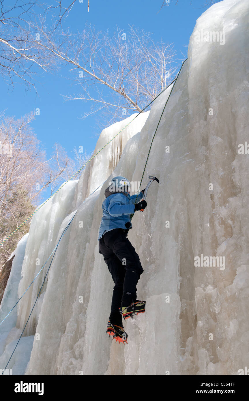 Female ice climber on Champney Falls in the White Mountain National ...