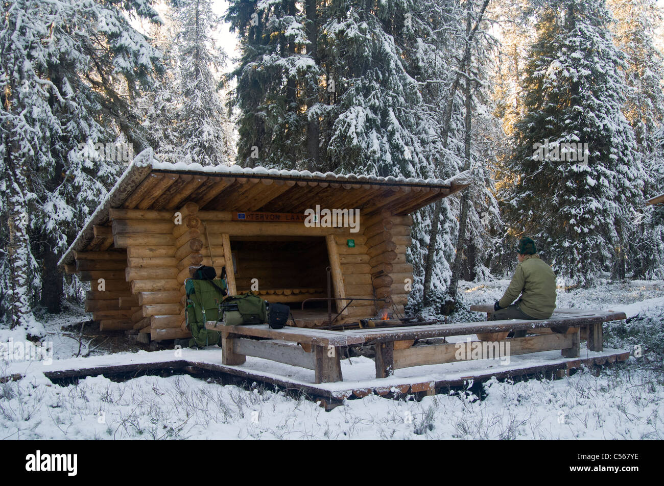 Backpacker at campfire Stock Photo - Alamy