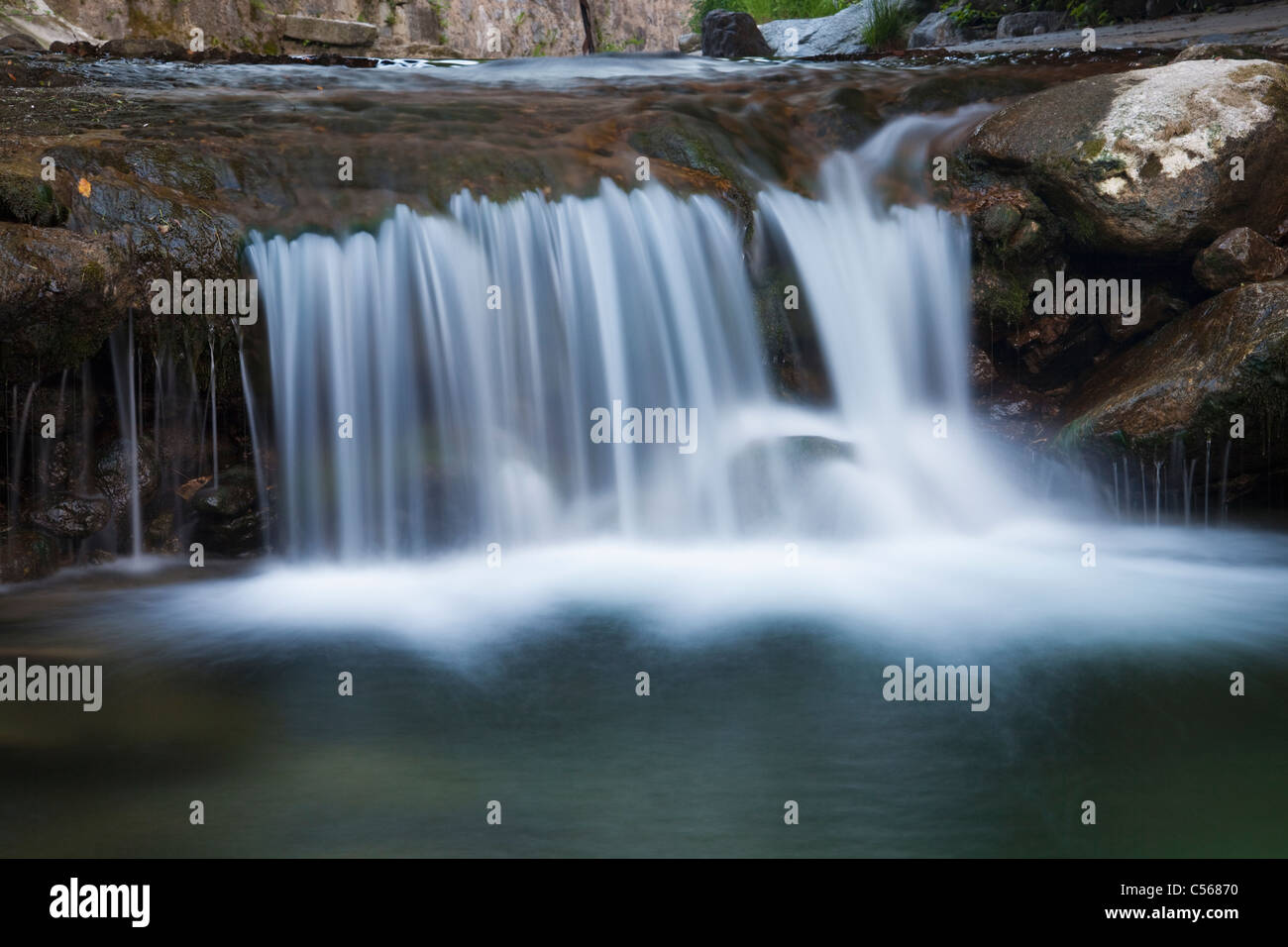 Small waterfall under the bridge in Bellagio Stock Photo - Alamy
