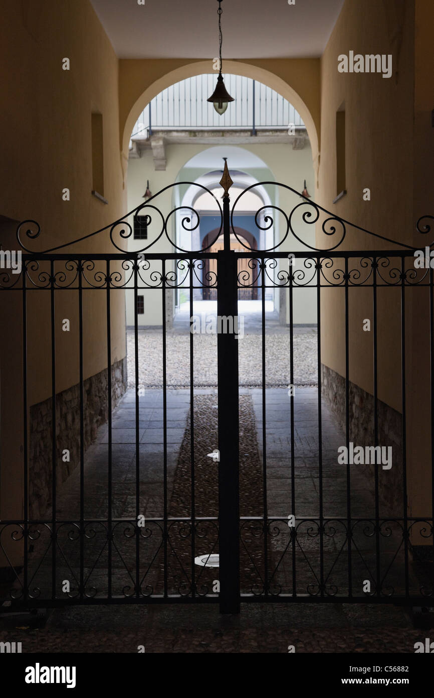 Closed gates to passage in historic center of Como Stock Photo - Alamy